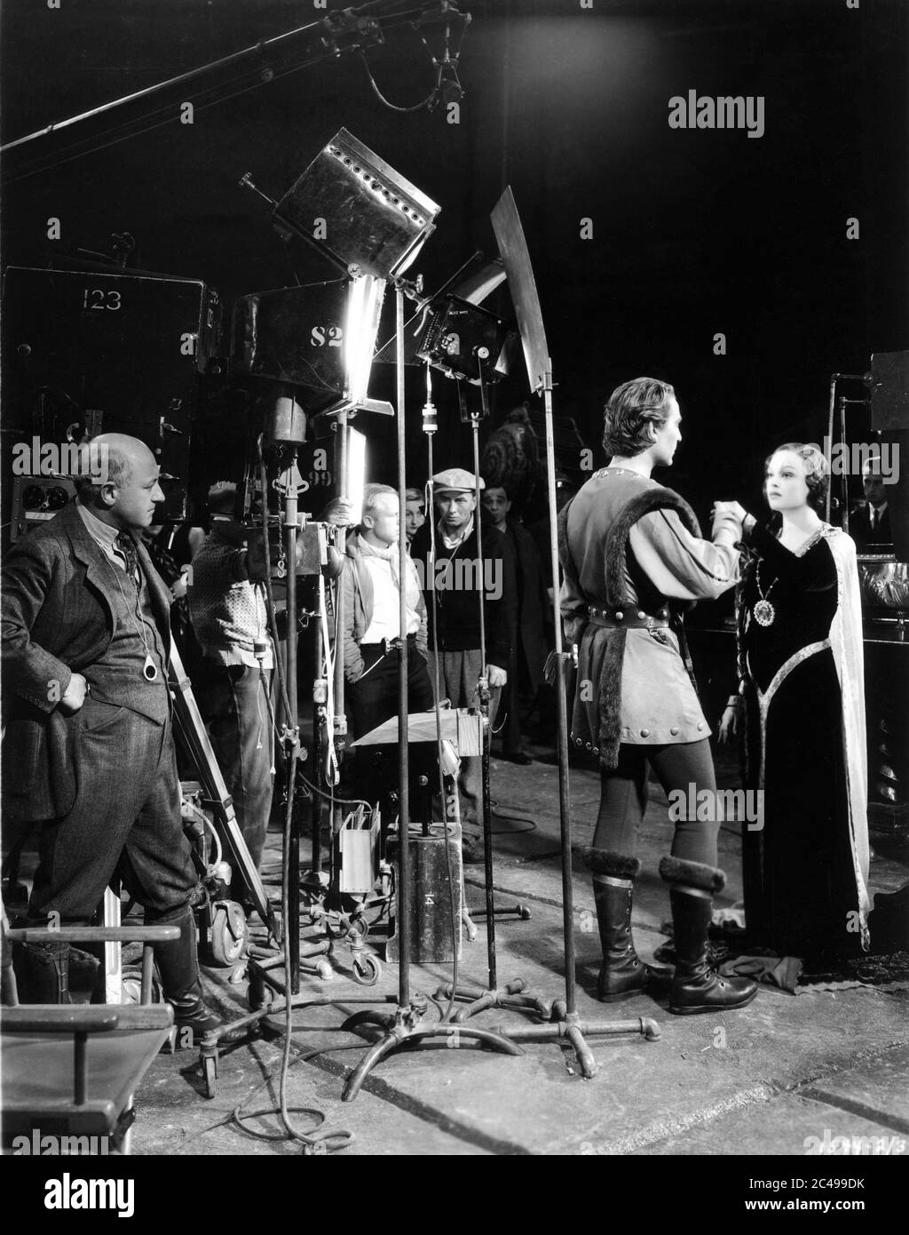 Director CECIL B. DeMILLE on set candid with movie crew filming HENRY ...