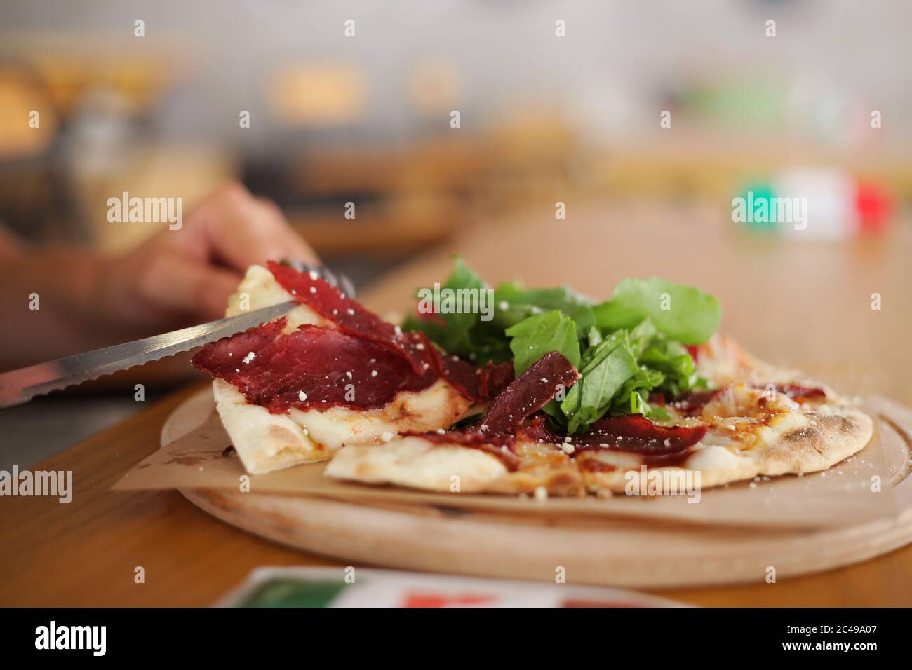 Pizza on wooden table. For fast food restaurant design or fast food ...