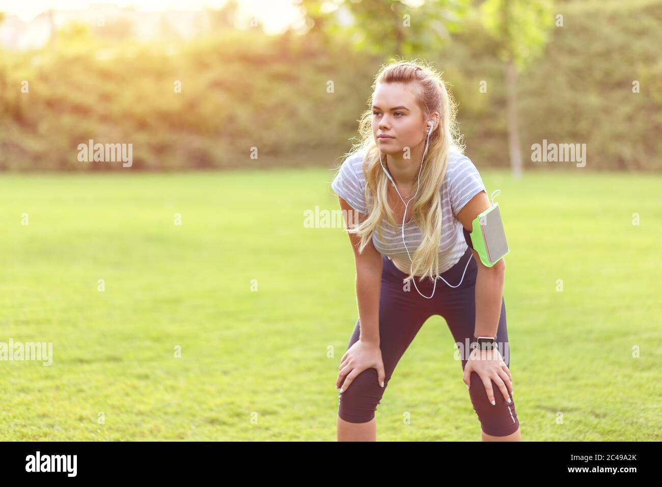 Tired female jogger resting after hi-res stock photography and images ...