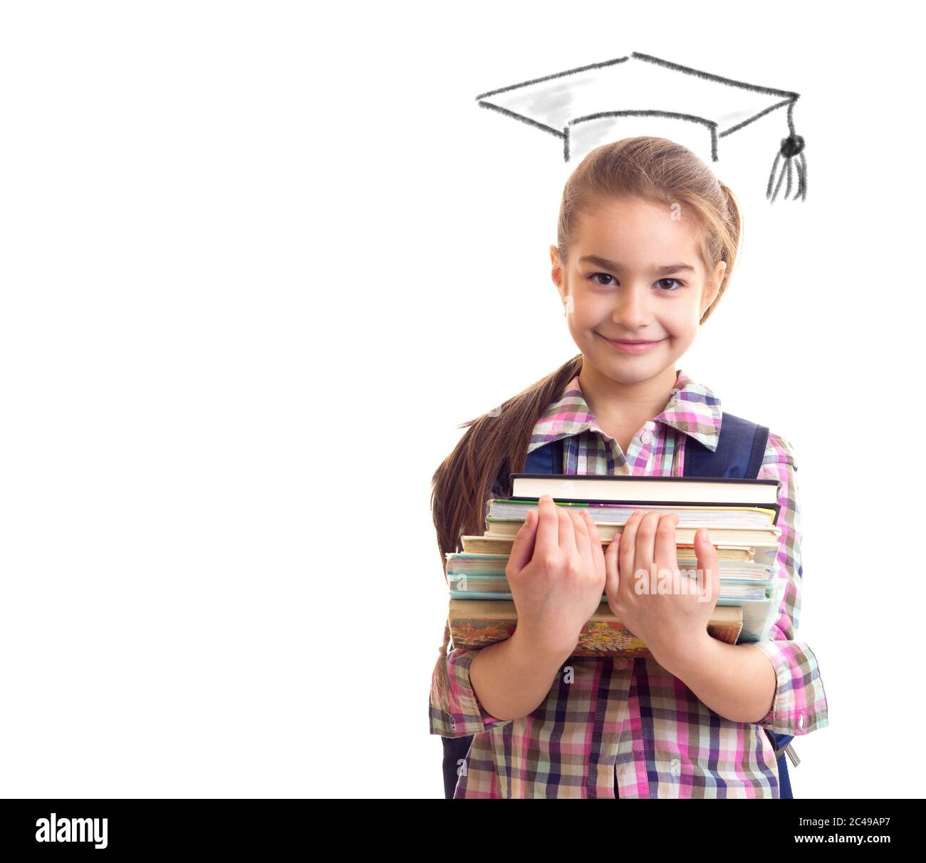 Schoolgirl with books looking in camera and smiling Stock Photo - Alamy