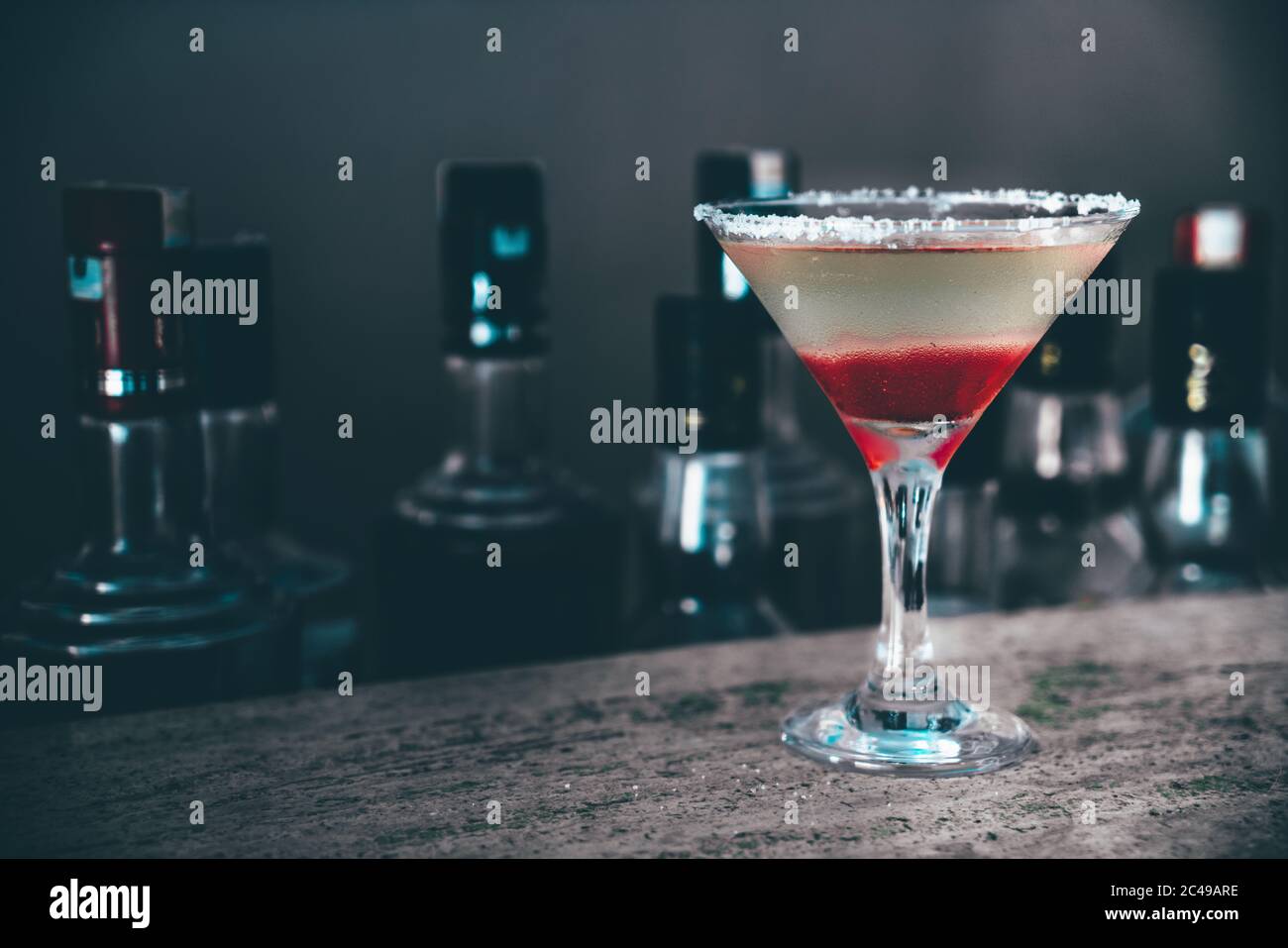 Glass of cocktail on bar background Stock Photo - Alamy
