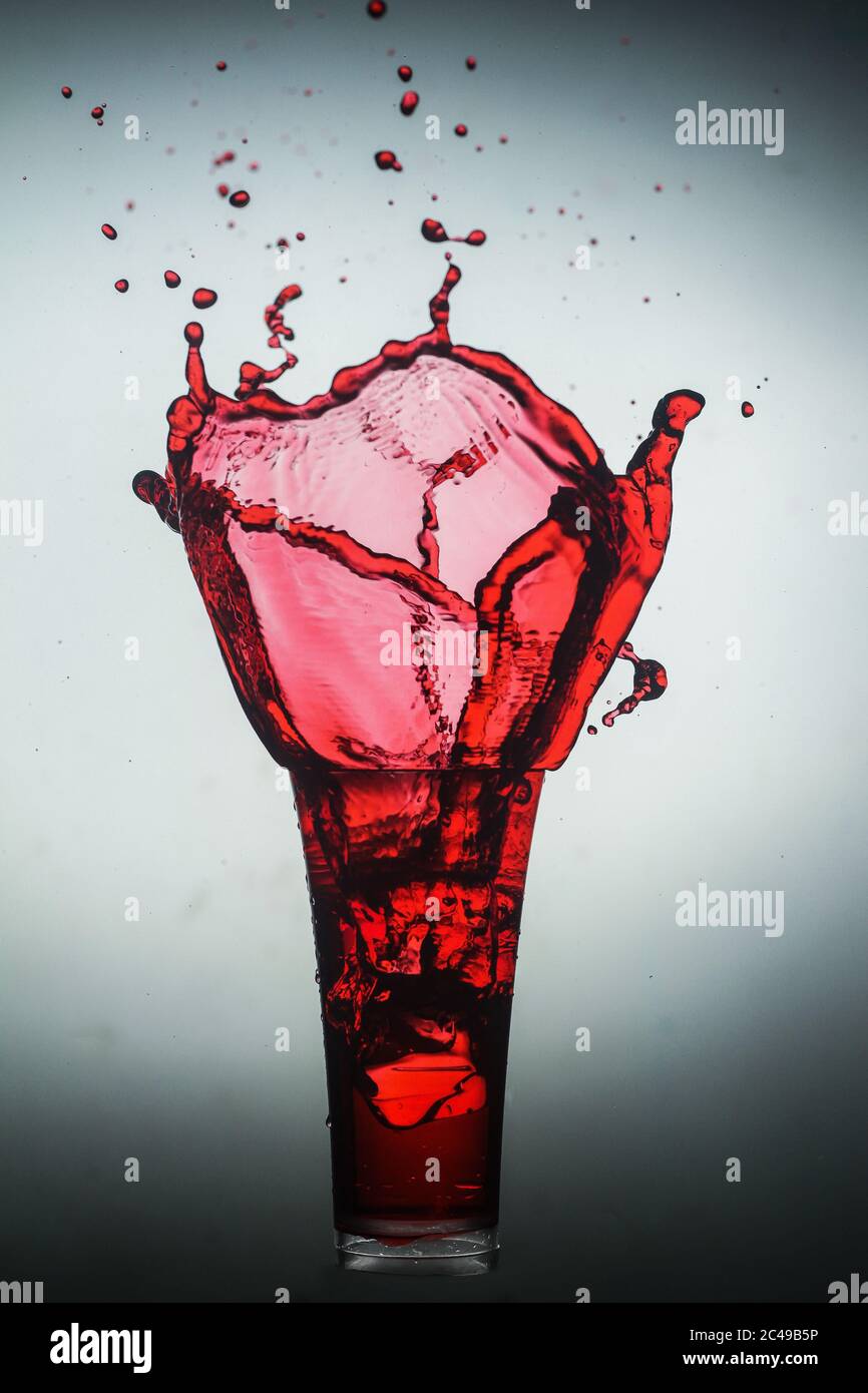 Red splash blue colour hi-res stock photography and images - Alamy