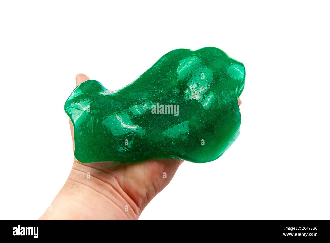 Hand holding a slime toy isolated on white background Stock Photo - Alamy