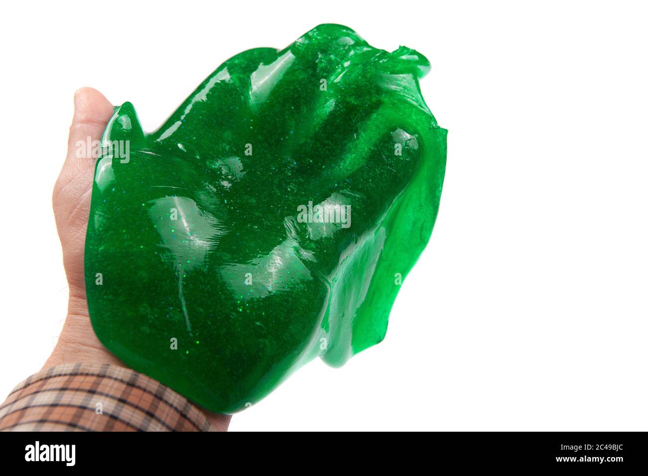 Hand holding a transparent green slime isolated on white Stock Photo ...