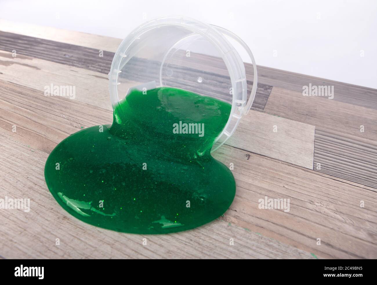 Green slime flowing out of a plastic bucket Stock Photo - Alamy