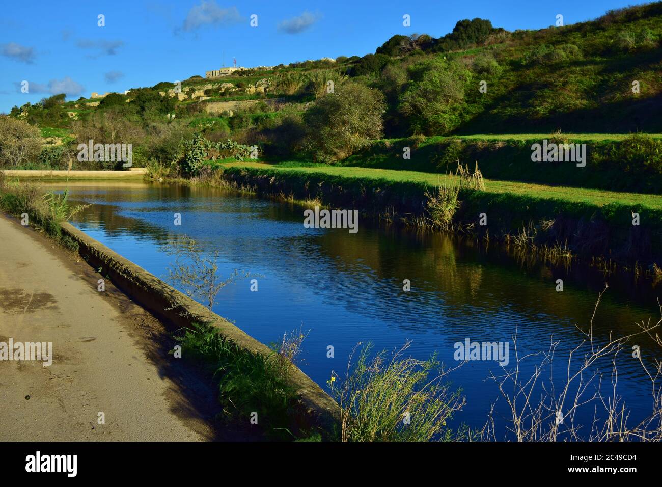 MTARFA, MALTA - Dec 11, 2014: Man made reservoir of rain water, held by ...
