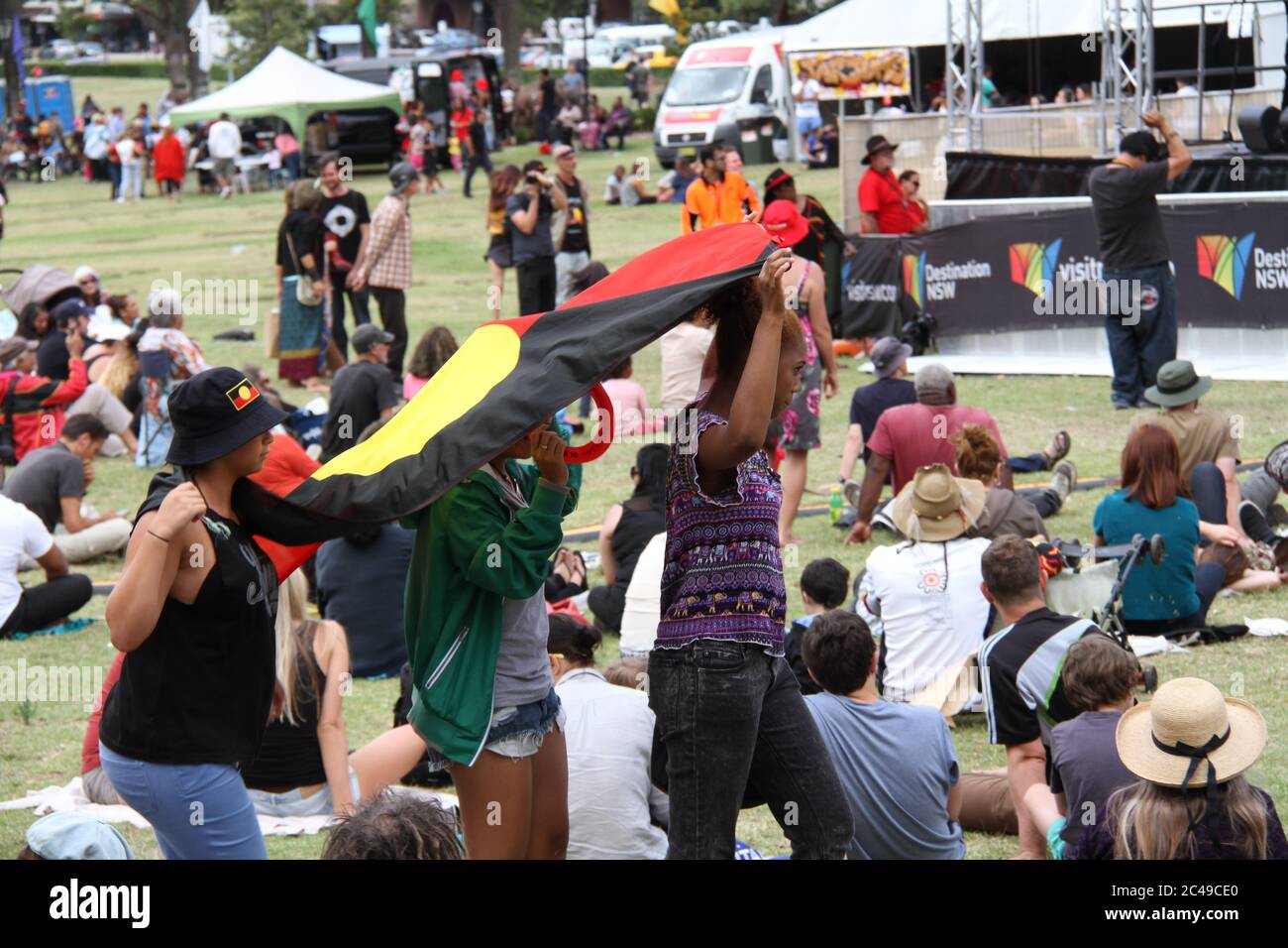 Girls carry the Aboriginal flag at the Yabun festival in Victoria Park ...