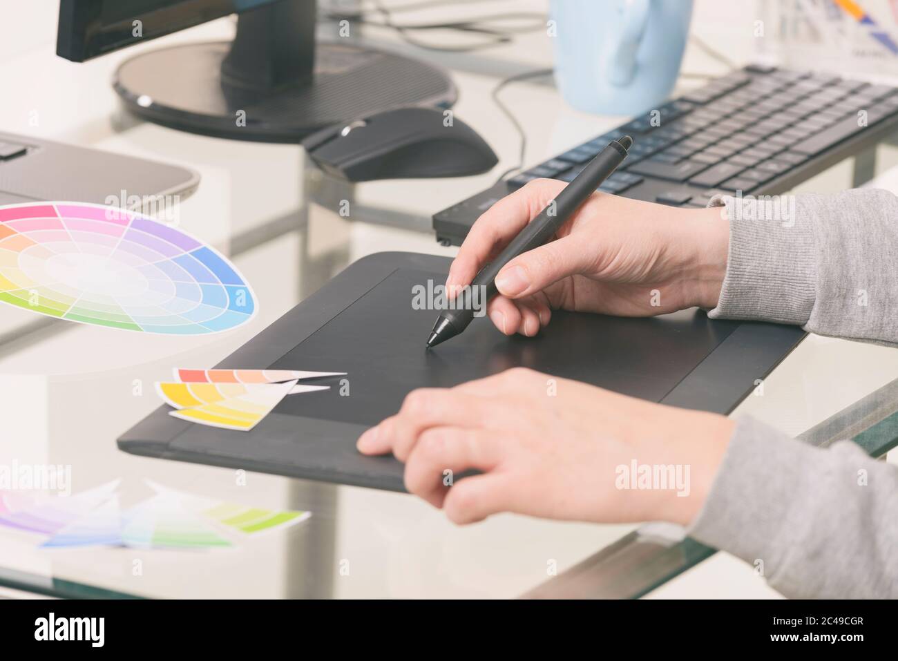 Designer using graphics tablet in the office Stock Photo - Alamy