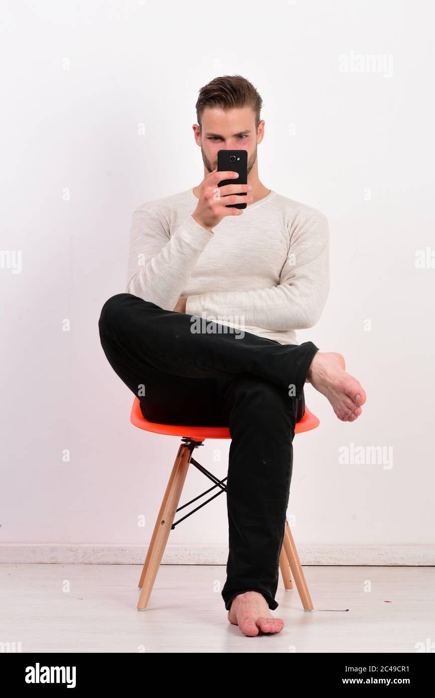 Man types message on smartphone hi-res stock photography and images - Alamy