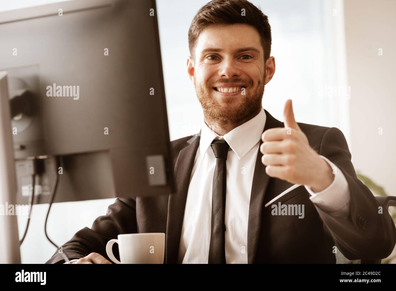 Business concept. Successful young businessman at work. Manager sitting ...