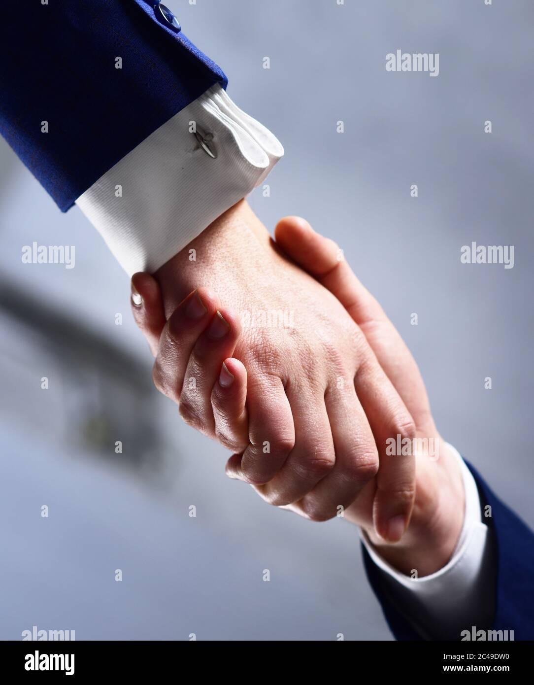 Successful businessmen handshaking isolated on white backround ...