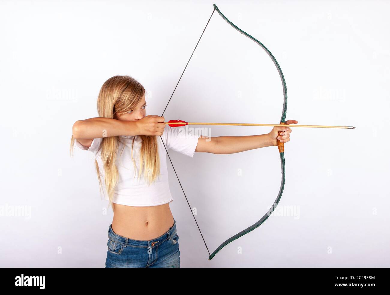 Beautiful woman aiming bow arrow hi-res stock photography and images ...