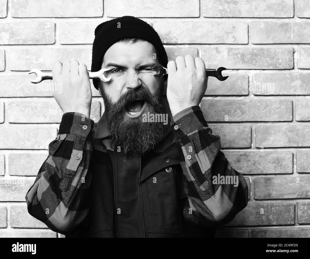 Bearded man, long beard. Brutal caucasian mechanic, unshaven hipster in ...