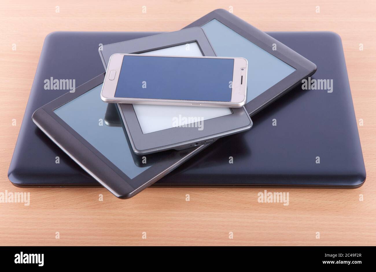 Stack made from notebook, tablet, ebook reader and a smatphone gadgets ...