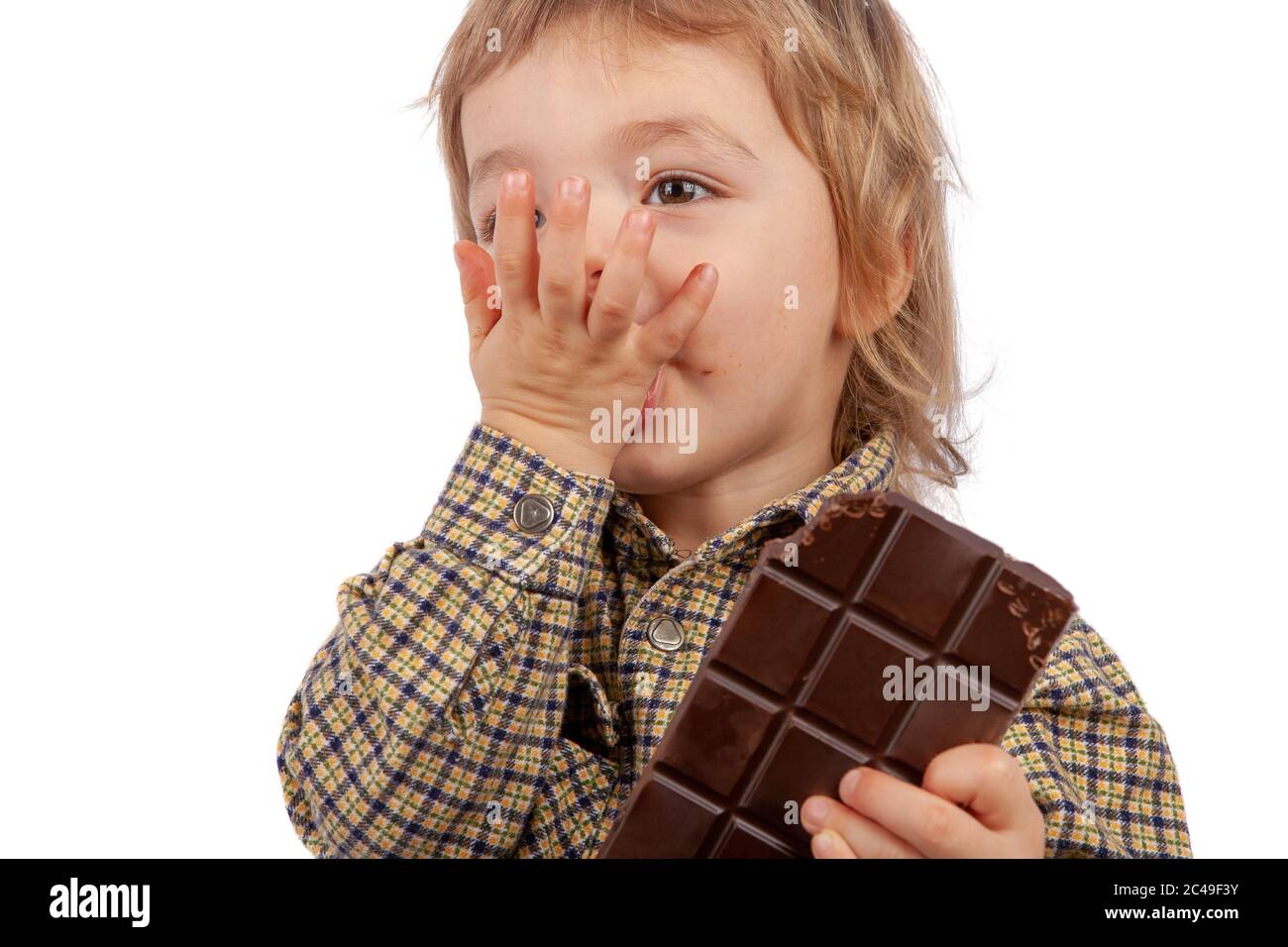 Adorable happy baby eating chocolate hi-res stock photography and ...