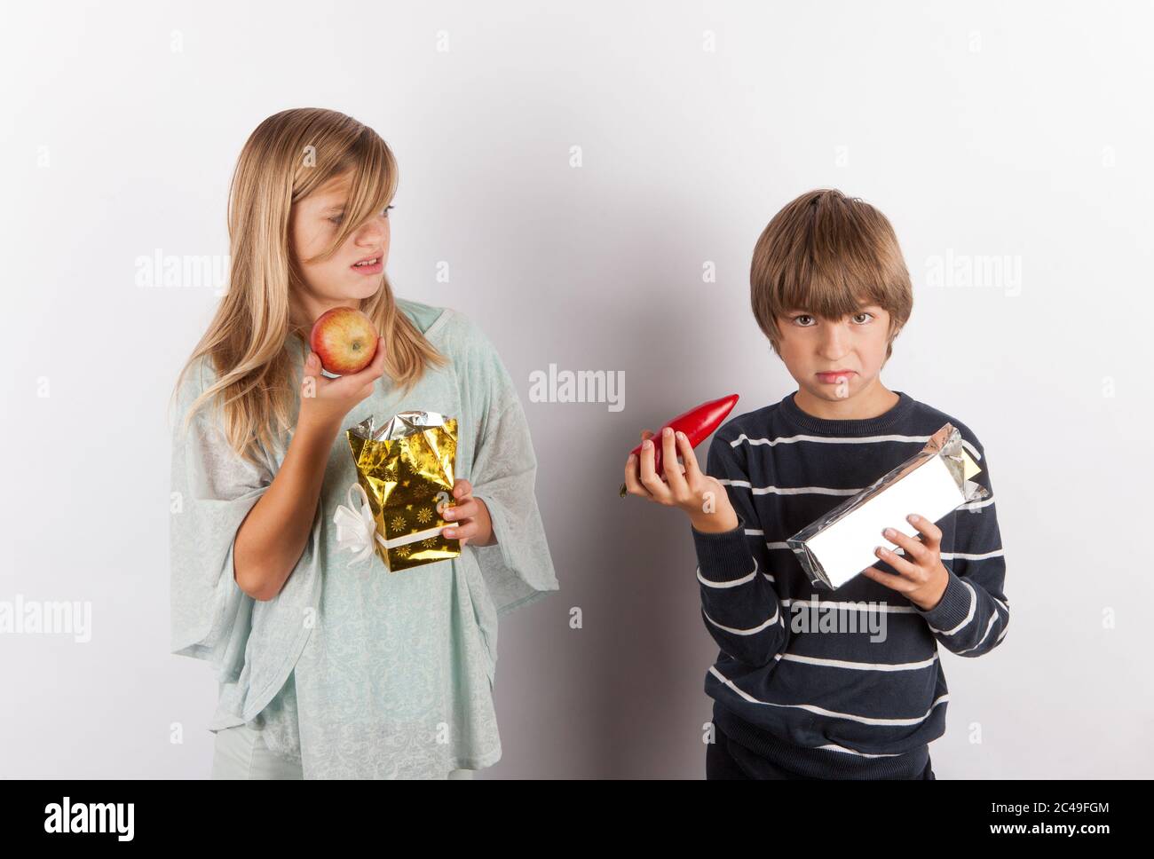 Children shocked by strange gifts. The present boxes contained apple ...