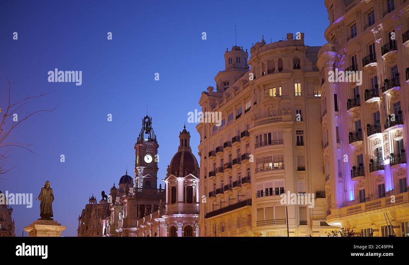Buildings and a clocktower at night in Spain Stock Photo - Alamy