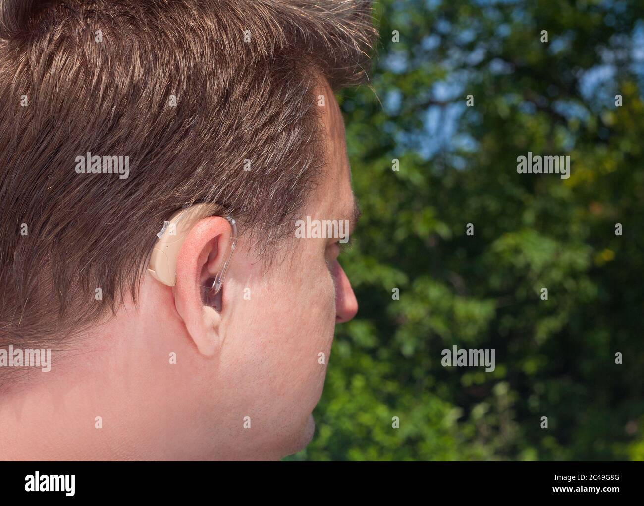 Hearing aid - outdoor wearing Stock Photo - Alamy