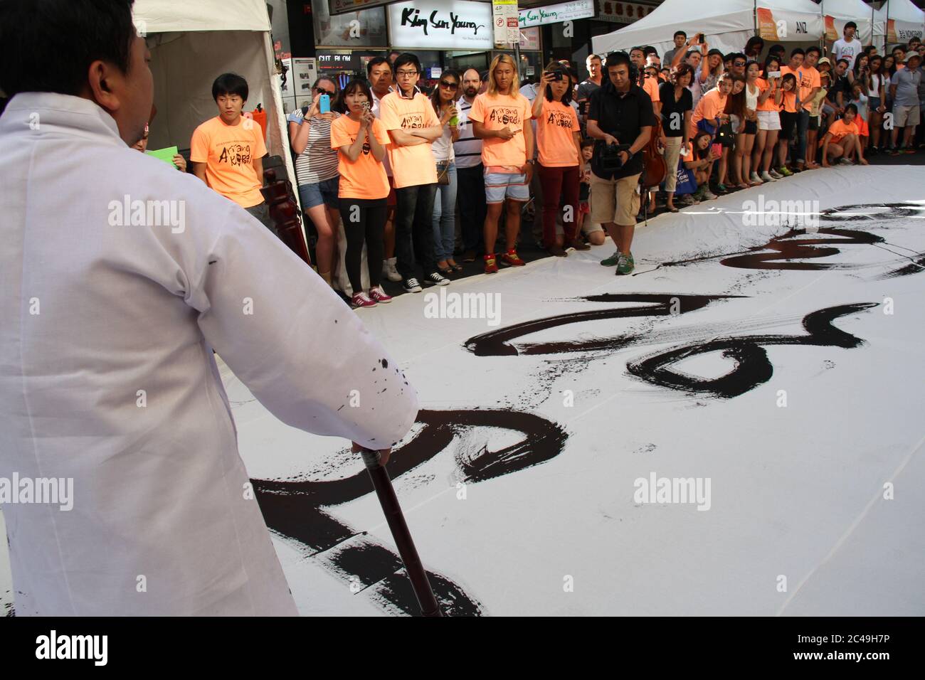 People watch a giant calligraphy performance at the Sydney Koreatown ...