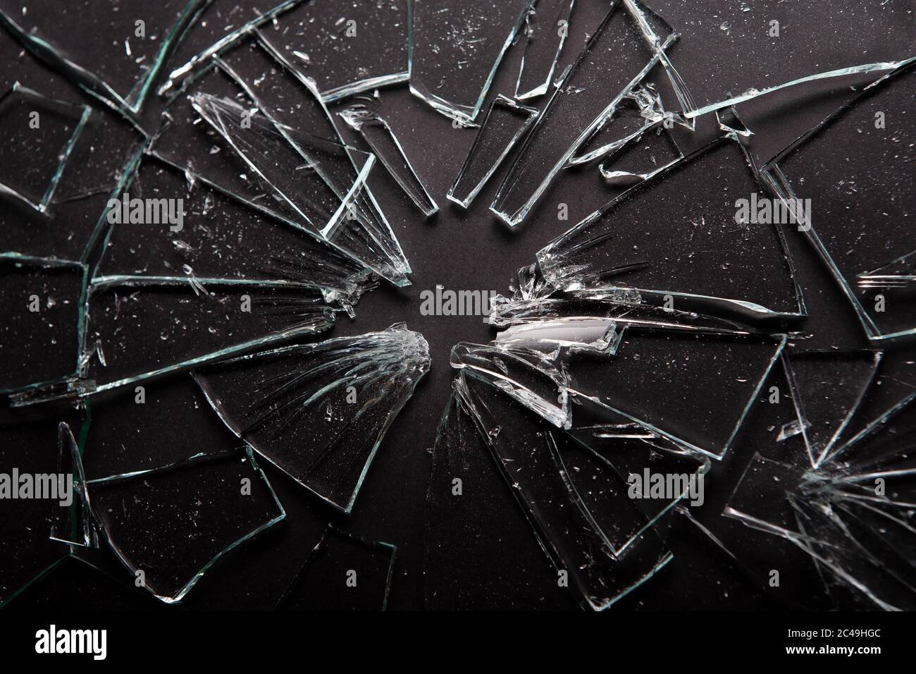 Close up of broken glass on black background with lots of glass ...