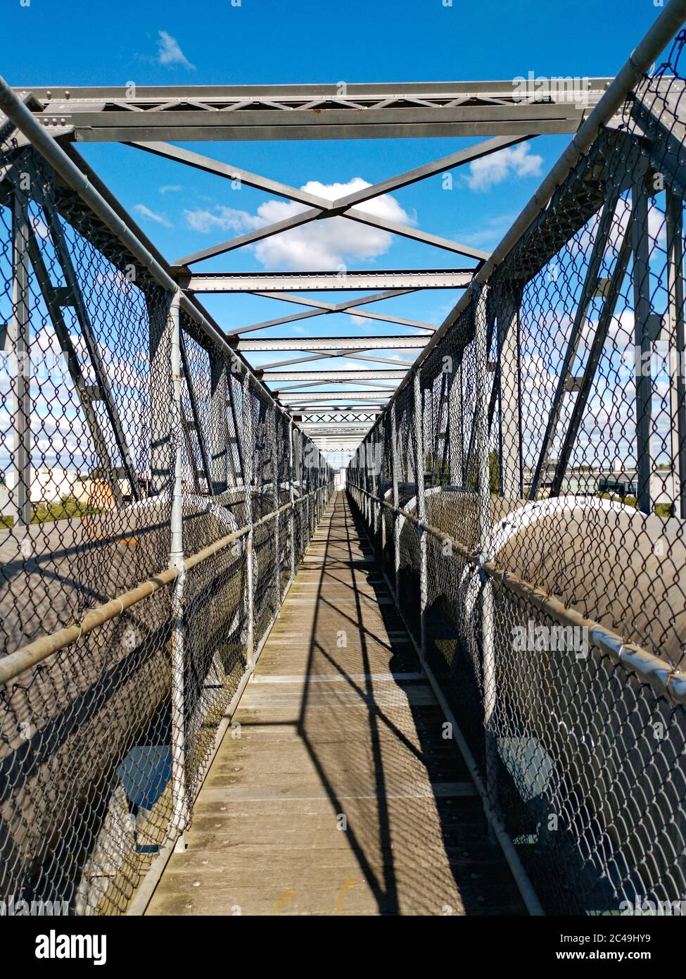 Tall pedestrian and water pipe bridge across the Parramatta river ...