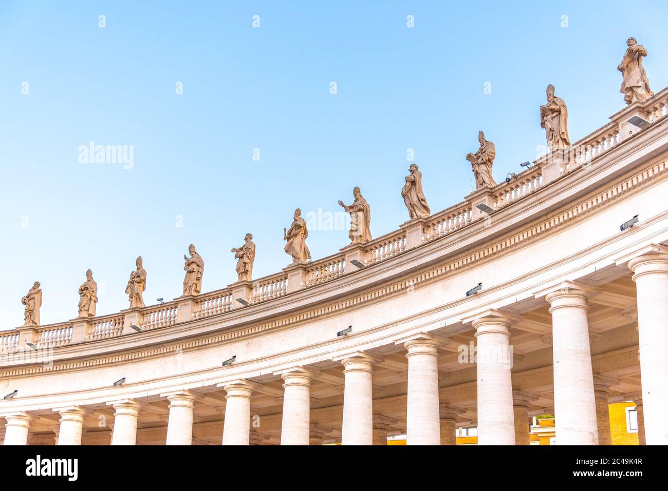 Doric Colonnade with statues of saints on the top. St. Peters Square, Vatican City Stock Photo ...