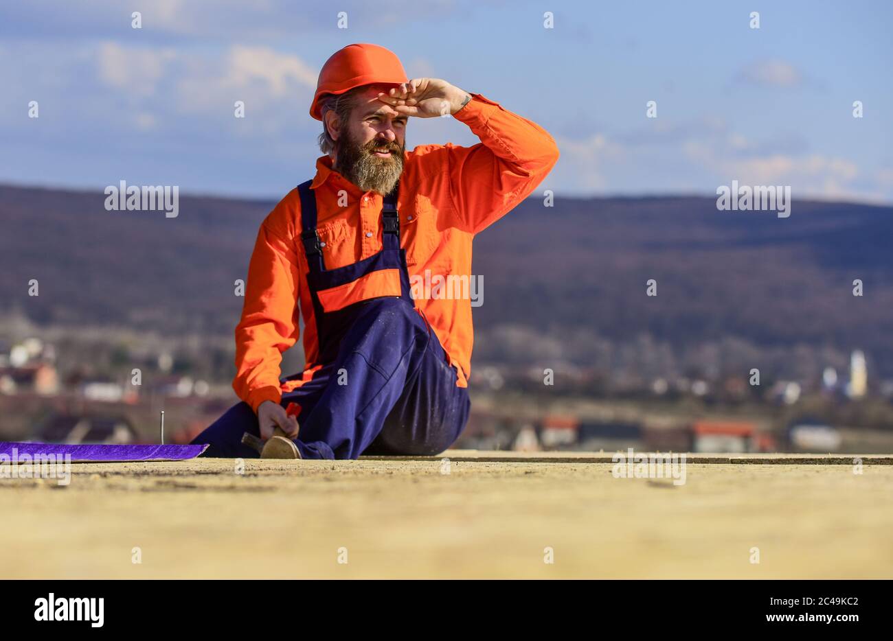 Man roofing surface. Professional master repair roof. Flat roof ...