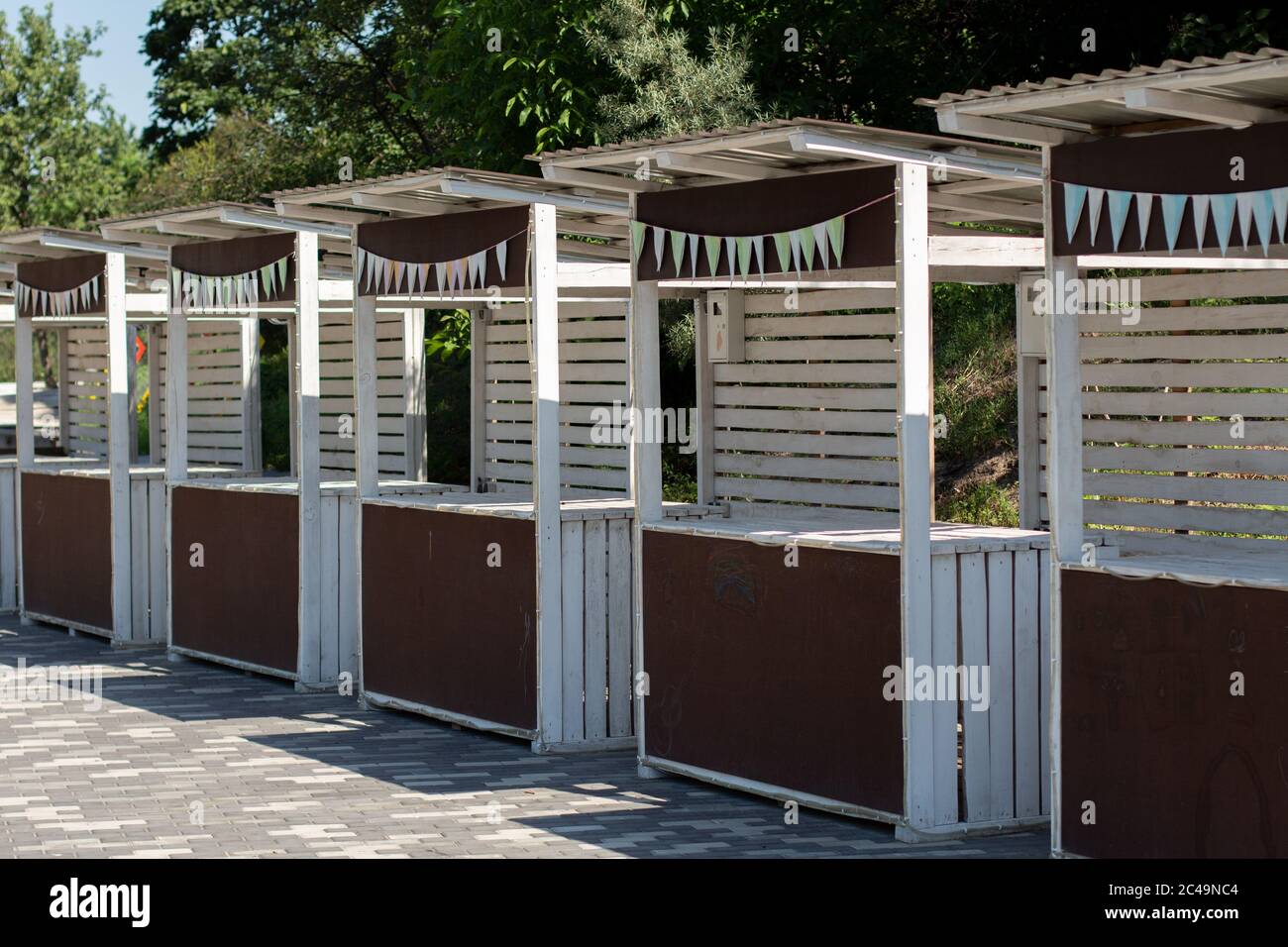 an empty wooden market stalls in park Stock Photo - Alamy
