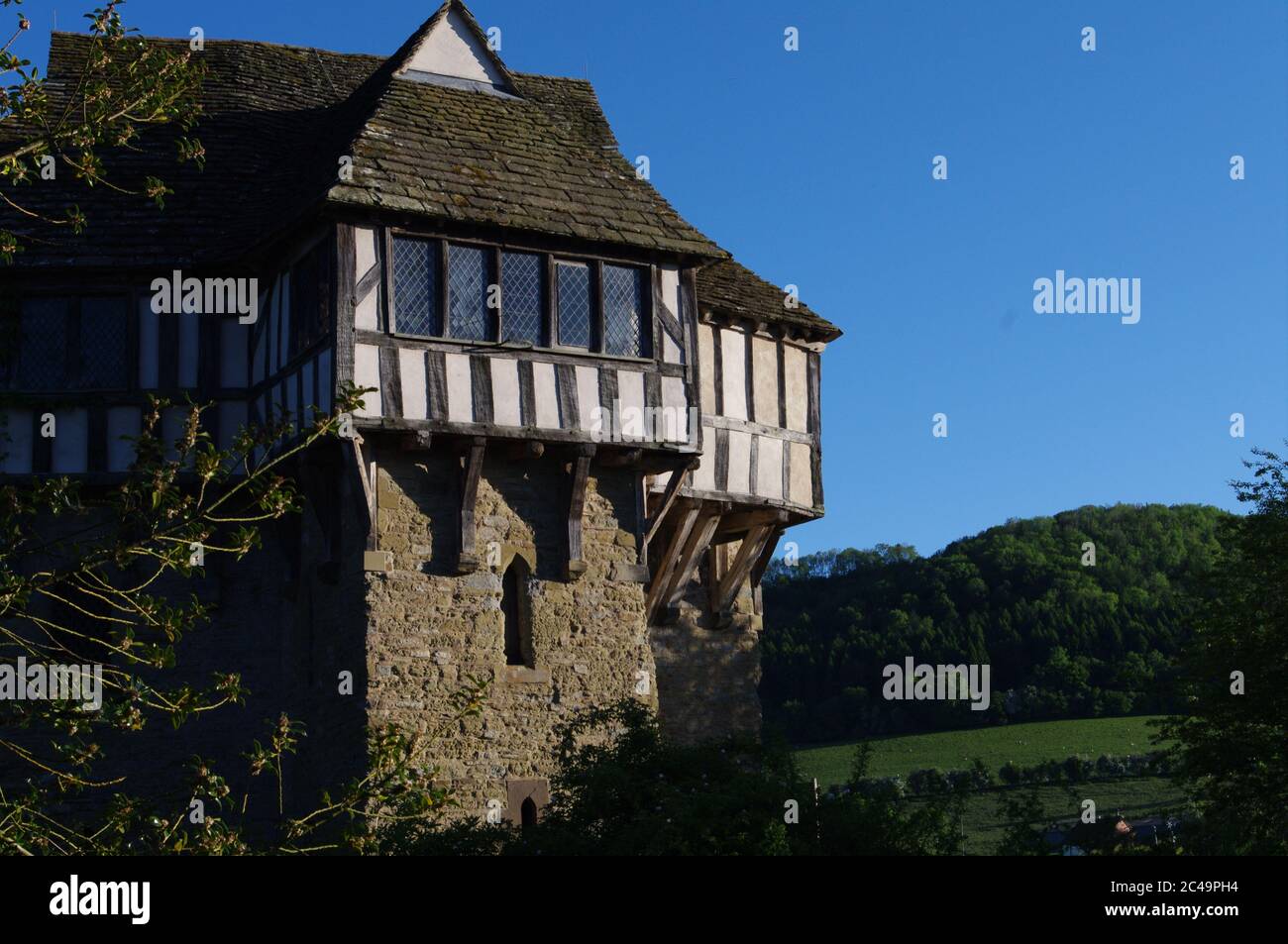 Stone building with windows and a roof in the forest Stock Photo - Alamy