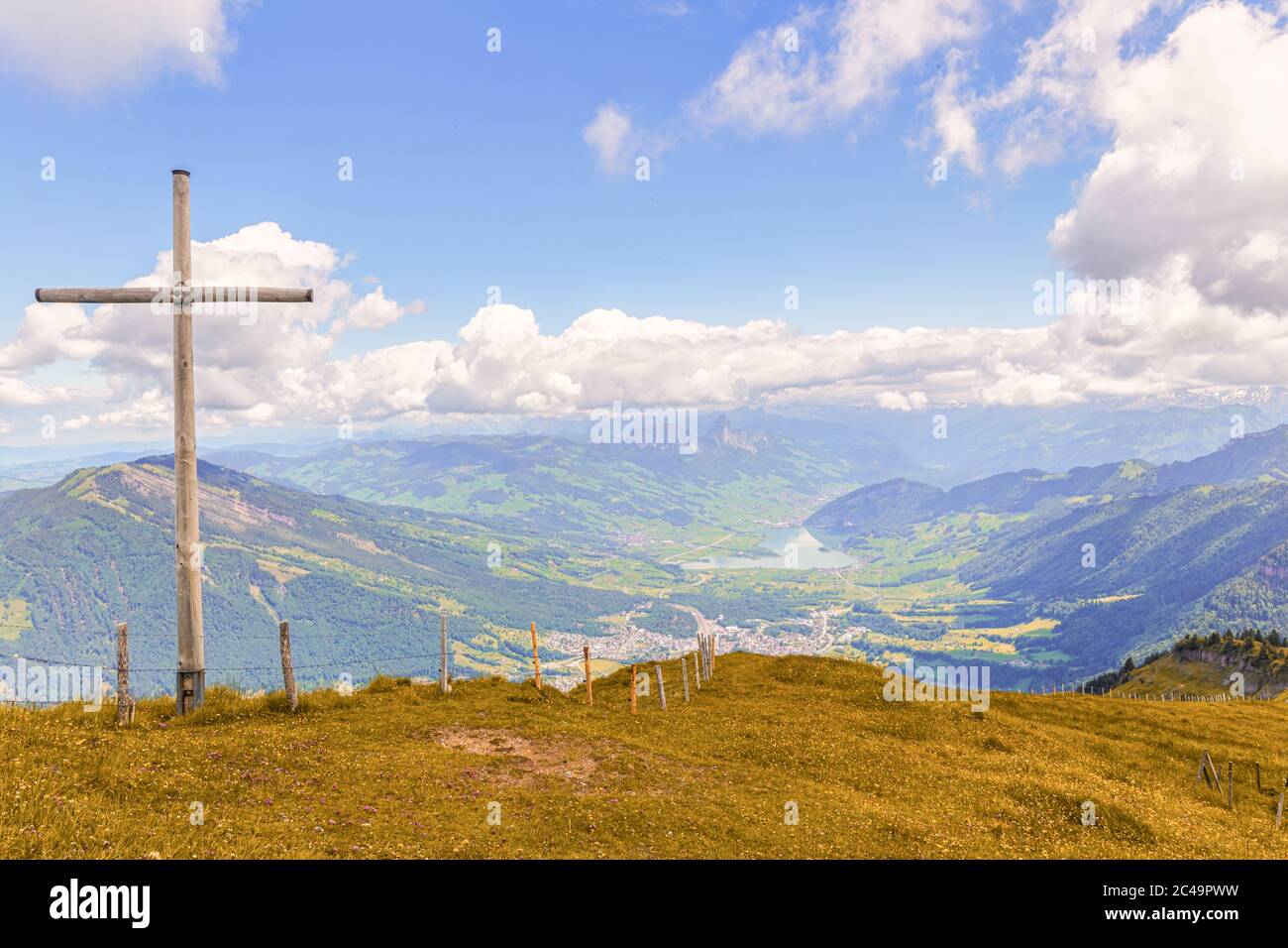Wooden cross on Mount Rigi overlooking Lake Lauerz (Lauerzersee) on a ...