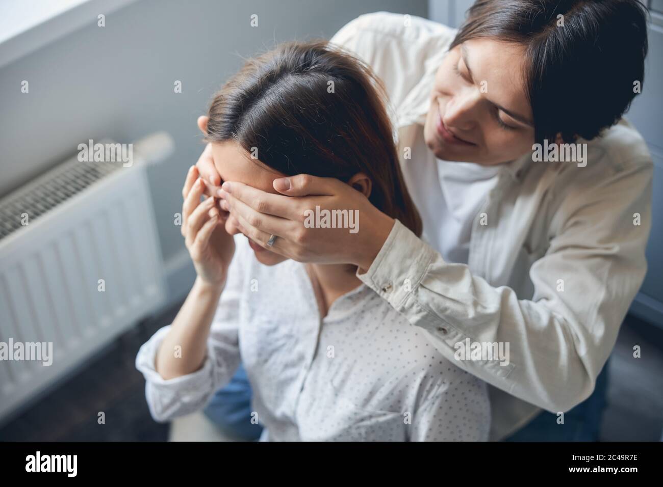 Cute surprise for beloved person made by happy man Stock Photo - Alamy