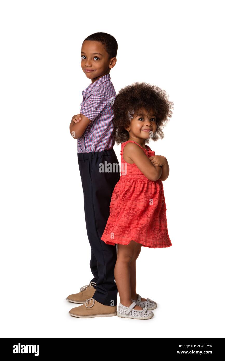 Two african american siblings in full length standing back to back with ...