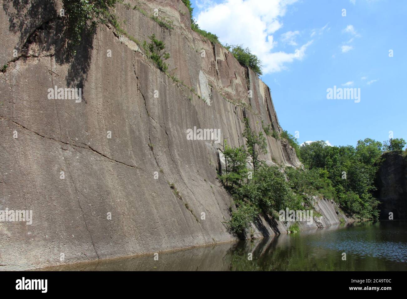 Steep cliff facing Prokop lake in Prague, Czech Republic - here you see ...