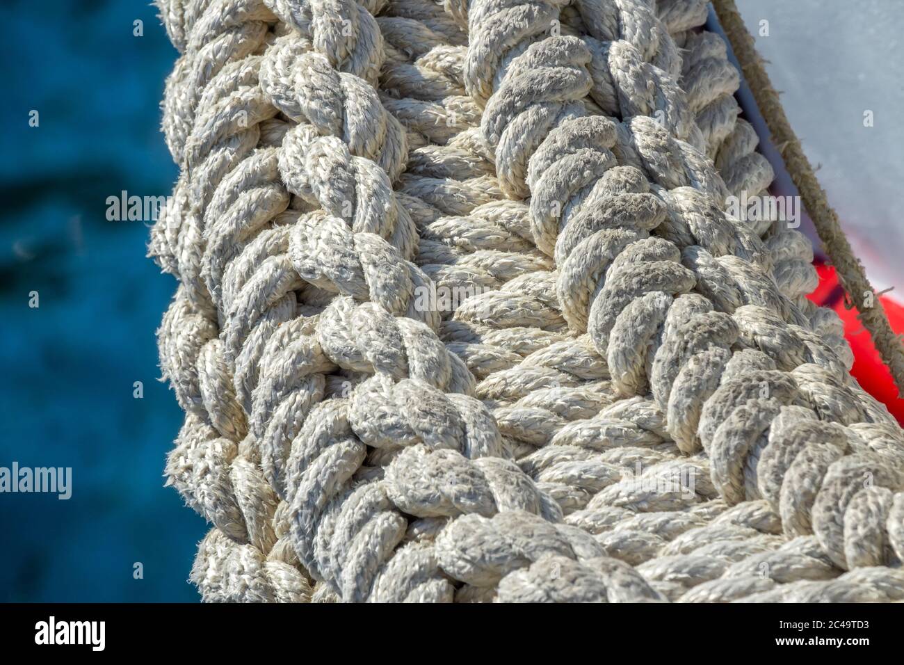 Old fishing boat. Handmade braided rope bumper close-up Stock Photo - Alamy