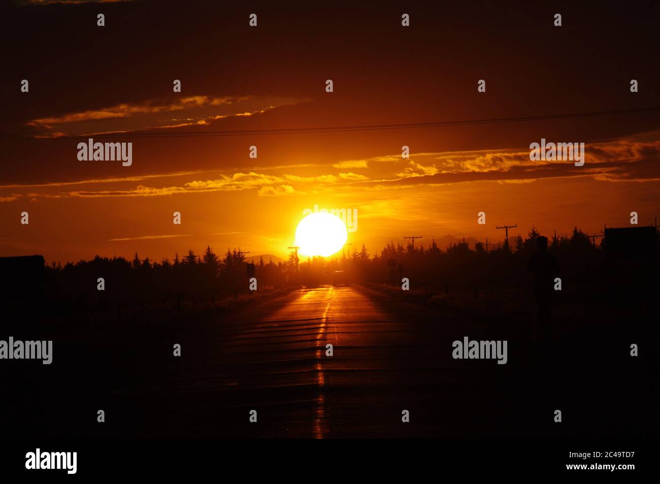 Sequence of images of a sunset, Setting sun at end of road, yellow ...