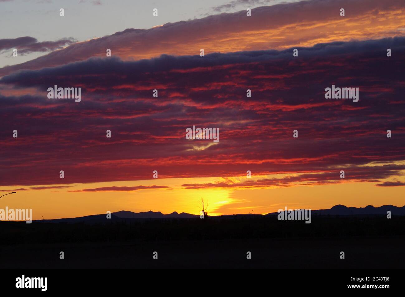 Magenta clouds at sunset over Silhouette horizon,Sequence of images of ...