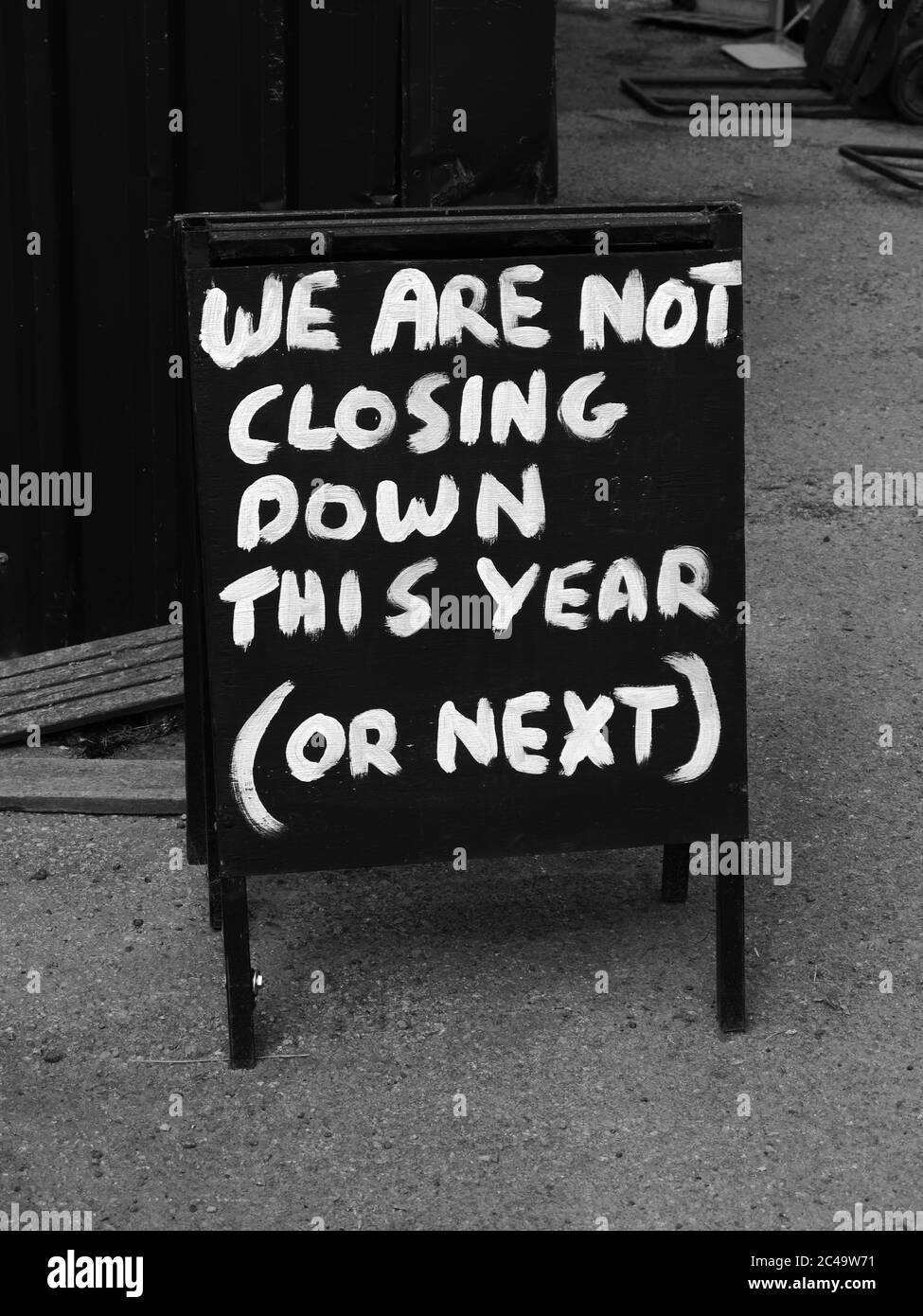 Local business informs customers that they are Not "Closing Down" sign ...