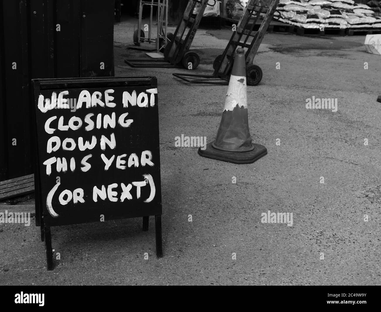 Local business informs customers that they are Not "Closing Down" sign ...