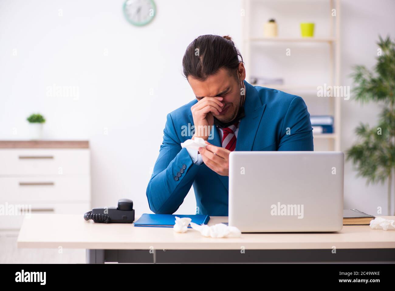 Sick employee suffering at workplace from covid-19 Stock Photo - Alamy