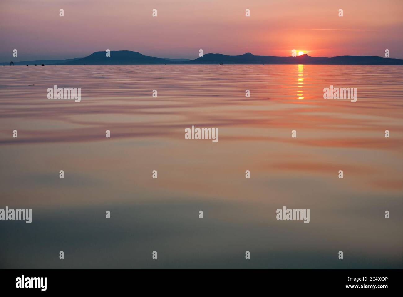 Typical sunset at Lake Balaton with the Badacsony Mountain in the ...