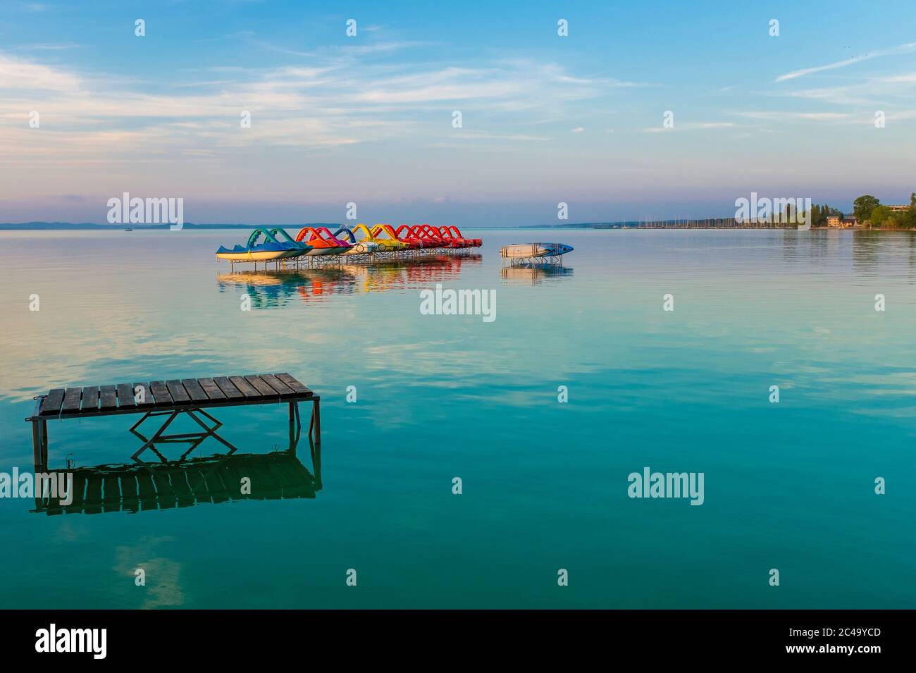 Travel background of pedal boats and kayaks on piers at lake Balaton ...