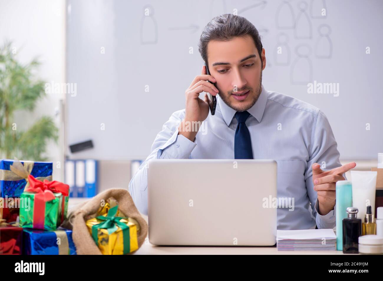 Young male shopaholic in online commerce concept Stock Photo - Alamy