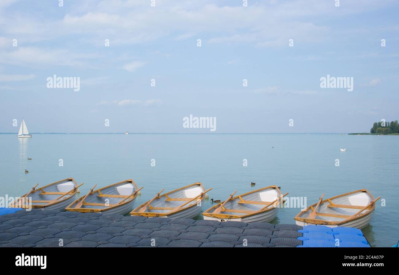 Empty row boats at lake Balaton Stock Photo - Alamy