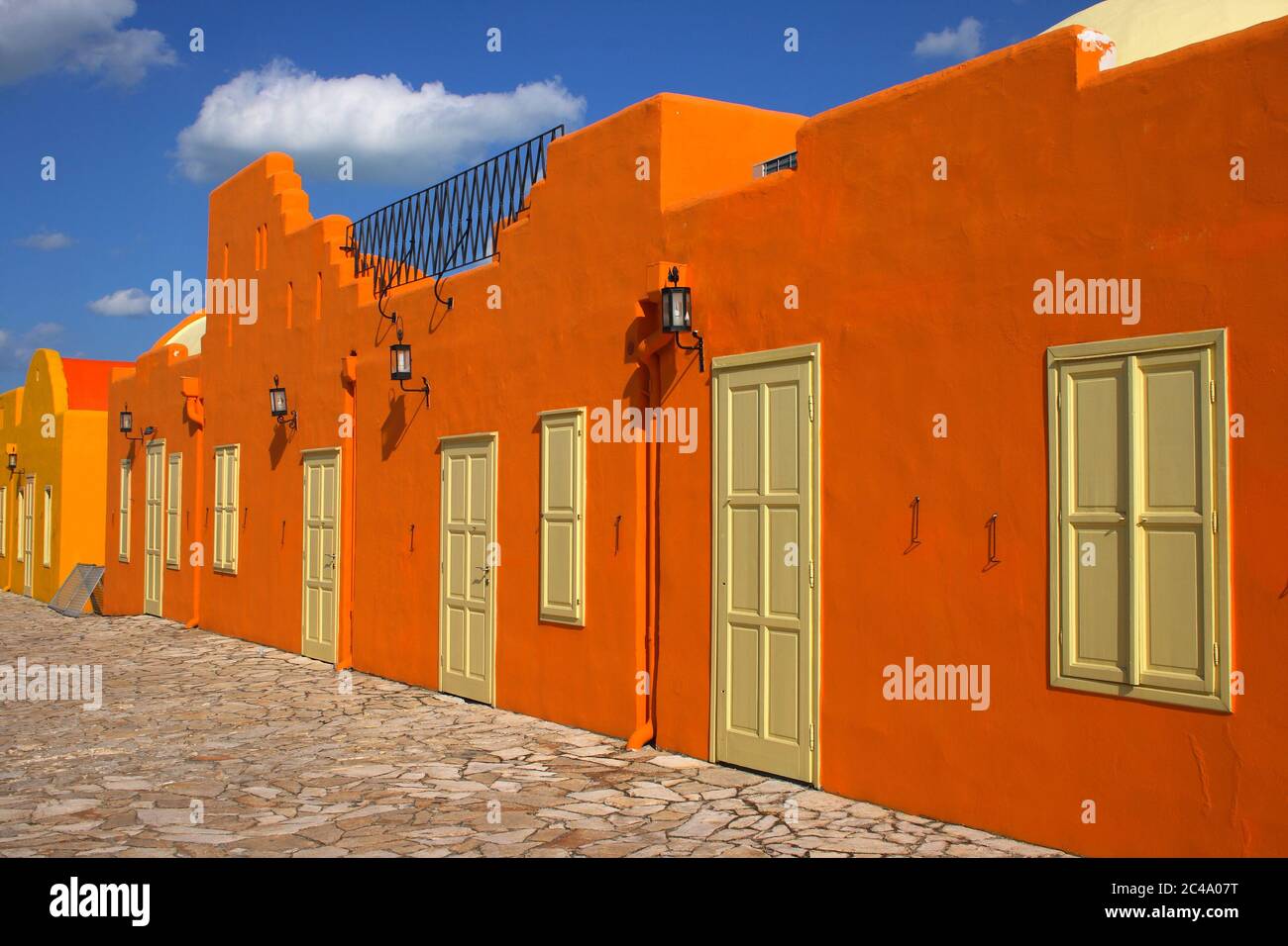 Greek style shops in vivid colors Stock Photo - Alamy