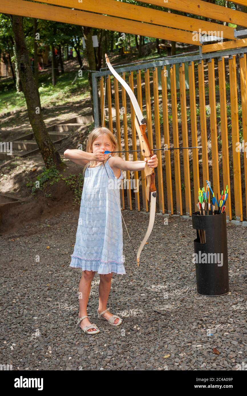 Cute girl archerying Stock Photo - Alamy