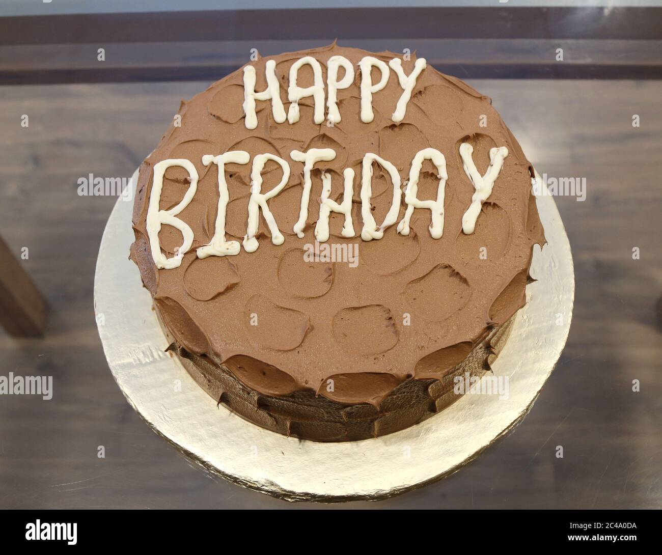 Creamy round chocolate birthday cake Stock Photo - Alamy