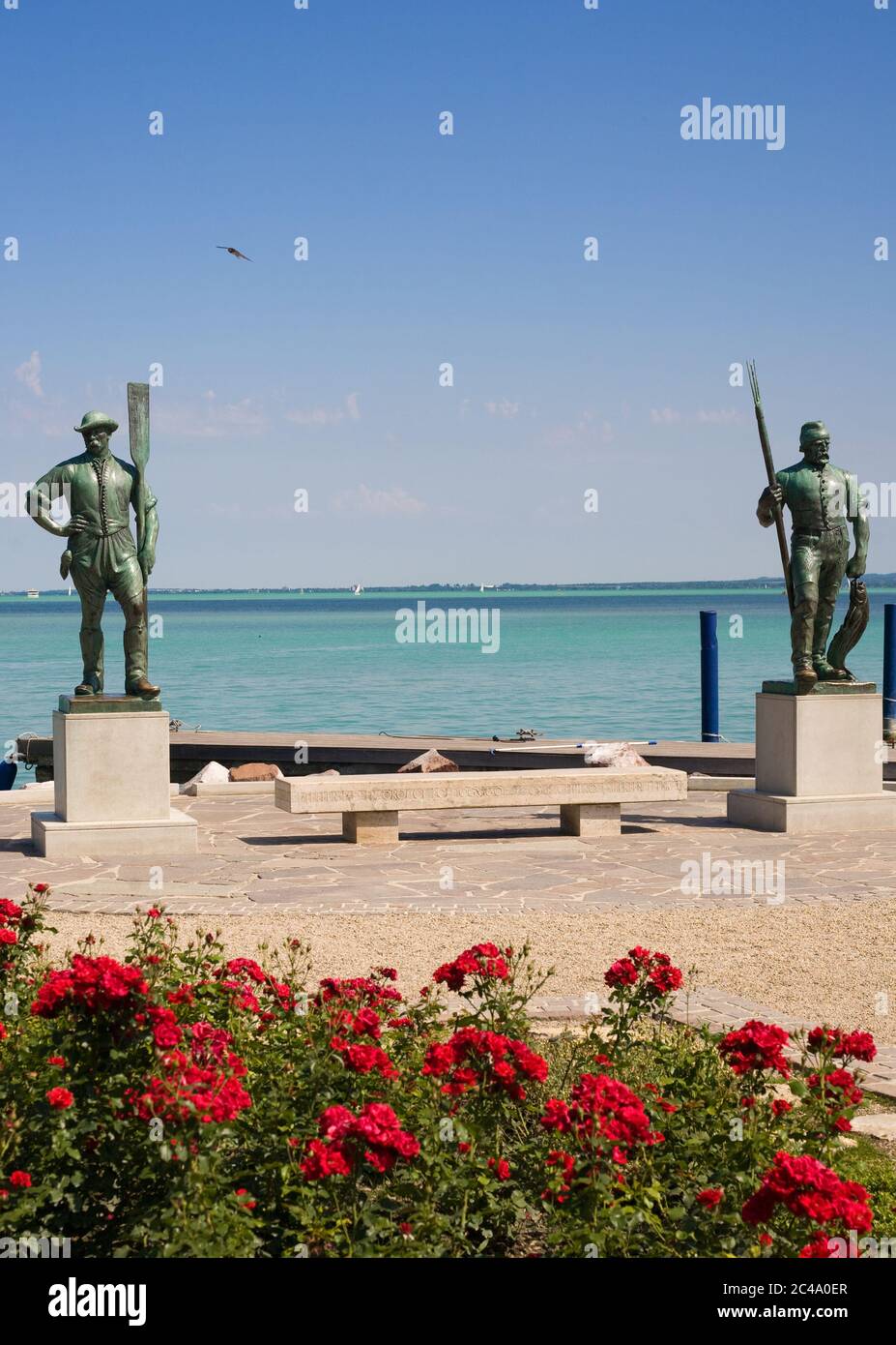 Statues of fisherman and boatman at the beach of Balatonfured, Hungary ...