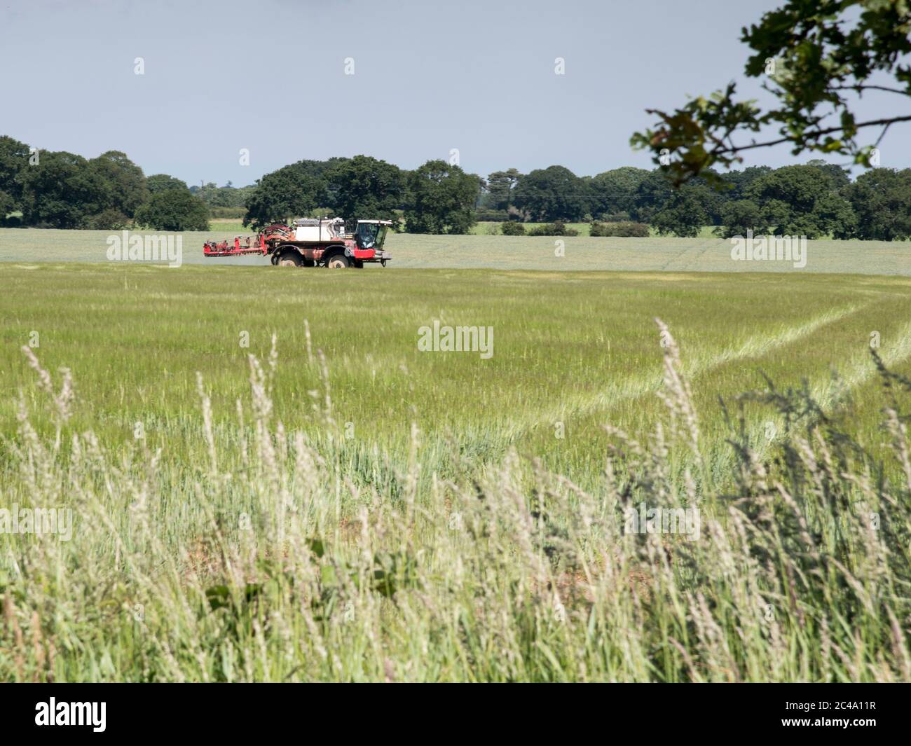 Farmer spraying fields Stock Photo - Alamy