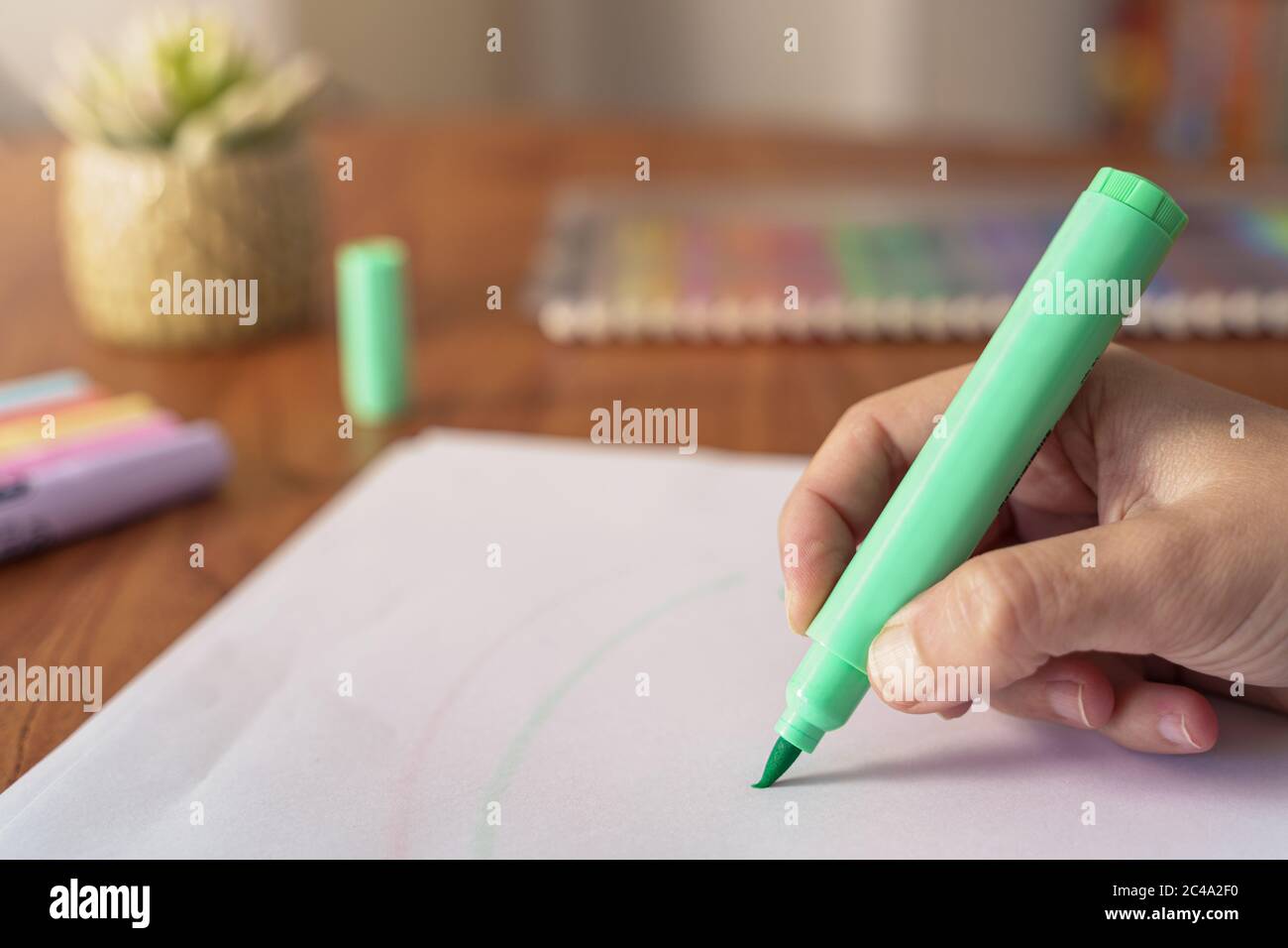 Hands of a woman drawing with colored markers at home Stock Photo - Alamy