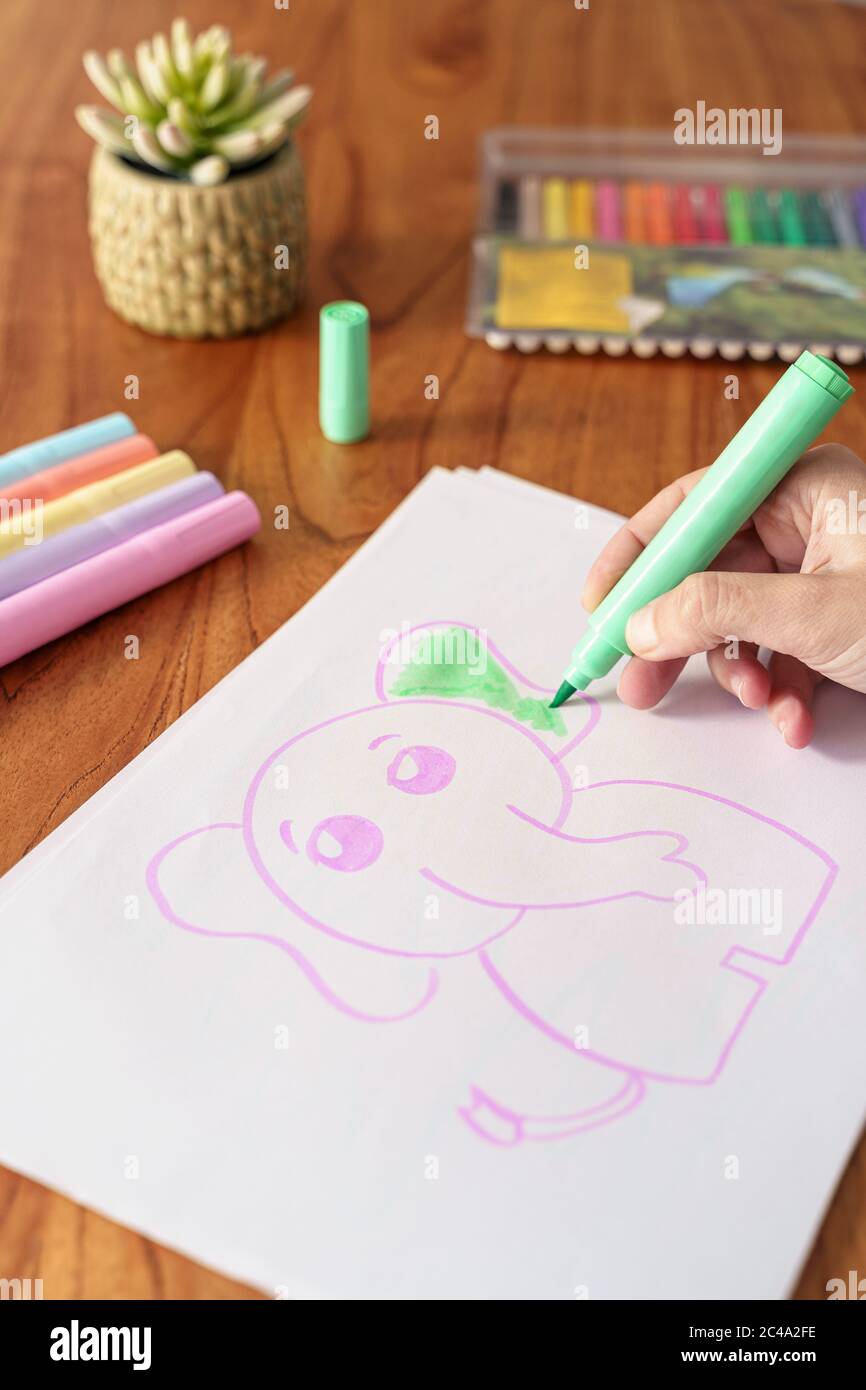 Hands of a woman drawing with colored markers at home Stock Photo - Alamy